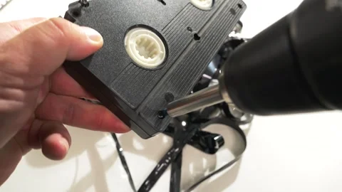 Unwinding a VHS cassette with reels and ... | Stock Video | Pond5