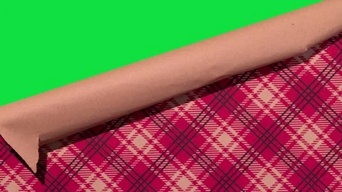 Unwrapping gift revealing a green screen... | Stock Video | Pond5