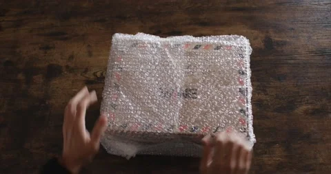 Unwrapping wine box. Bubble wrapping pap... | Stock Video | Pond5