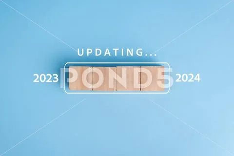 Updating progress 2024 wood cube count down on background. Stock Photo ...