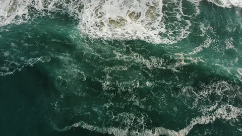 upper view of ocean surf washing sand be... | Stock Video | Pond5