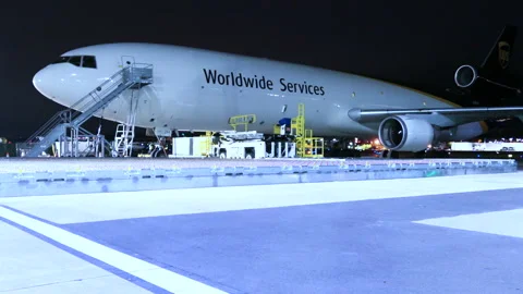 UPS plane loading at the airport at nigh... | Stock Video | Pond5