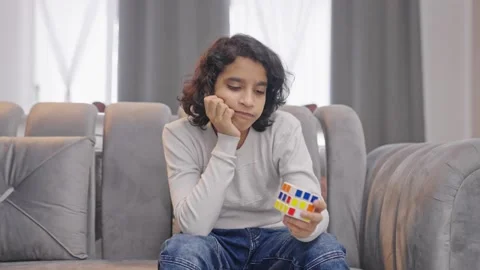 Upset Indian kid boy unable to solve Rub... | Stock Video | Pond5