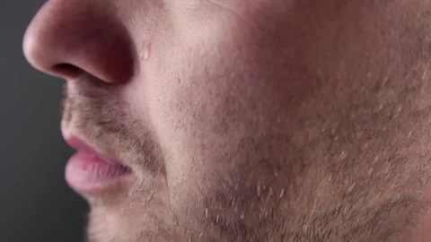 Upset man crying, drop of tear running d... | Stock Video | Pond5