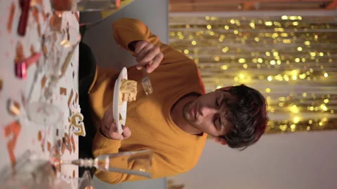Upset young drunk man eating cake in mes... | Stock Video | Pond5