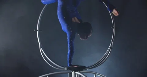 Upside down split on a spinning hoop by ... | Stock Video | Pond5