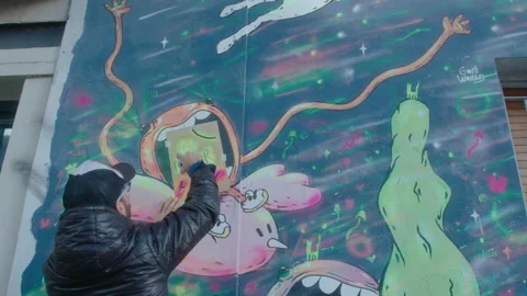 Urban Artist Adding a Sign to Graffiti o... | Stock Video | Pond5