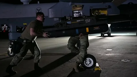 U.S. Airmen loading Hellfire missiles on... | Stock Video | Pond5