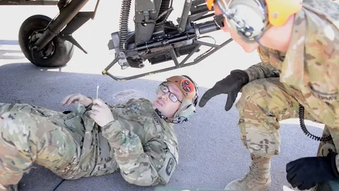 U.S. army aircraft armorers rearm AH-64 ... | Stock Video | Pond5
