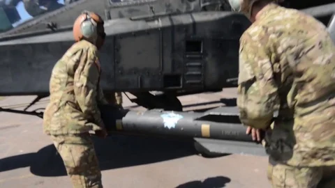 U.S. army aircraft armorers rearming AH-... | Stock Video | Pond5