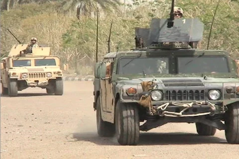 US Army armored Humvees head down a road... | Stock Video | Pond5