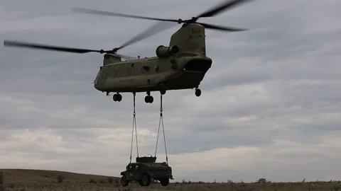 U.S. Army CH-47 Chinook lifting Humvee a... | Stock Video | Pond5