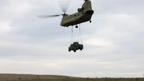 U.S. Army CH-47 Chinook carrying Humvee ... | Stock Video | Pond5