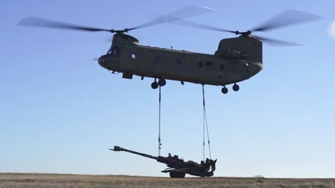U.S. Army CH-47 Chinook lifting M777 How... | Stock Video | Pond5