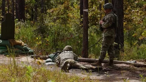 U.S. Army sniper firing rifle from sandb... | Stock Video | Pond5
