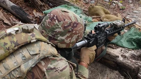 U.S. Army soldier firing rifle from bunk... | Stock Video | Pond5
