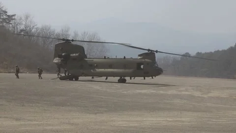 U.S. Army soldiers exit rear of CH-47 Ch... | Stock Video | Pond5