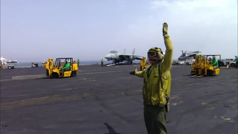 US Carrier Crew Demonstrates Hand Signal... | Stock Video | Pond5