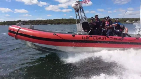 U.S. Coast Guard aim weapons at power bo... | Stock Video | Pond5