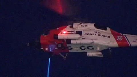 US Coast Guard helicopter flies overhead... | Stock Video | Pond5
