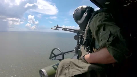 U.S. Marine door gunner fires M240 machi... | Stock Video | Pond5