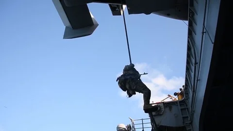 U.S. Marine fast ropes on to aircraft el... | Stock Video | Pond5
