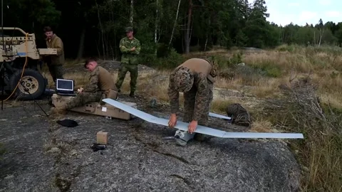 U.S. Marine fitting wings to RQ-20 Puma ... | Stock Video | Pond5