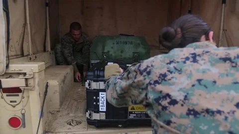 US Marine securing load to vehicle at Ca... | Stock Video | Pond5
