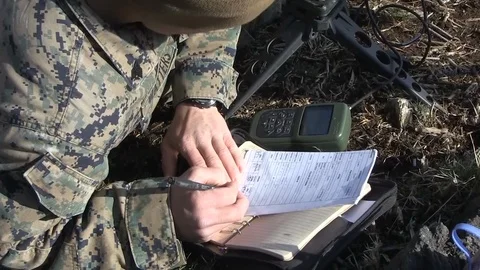 U.S. Marine writing in notebook during c... | Stock Video | Pond5
