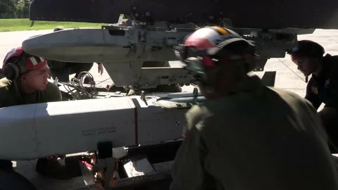 U.S. Marines load missiles onto AV-8B Ha... | Stock Video | Pond5
