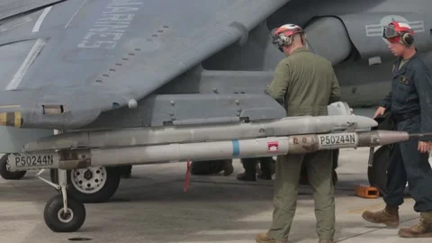 U.S. Marines load ordnance onto an AV-8B... | Stock Video | Pond5