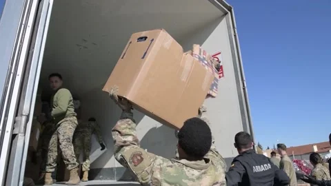 U.S. military personnel loading boxes of... | Stock Video | Pond5