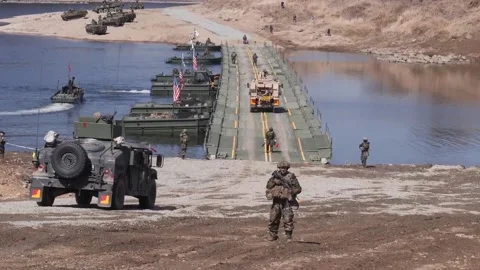 U.S. military vehicles drive onto floati... | Stock Video | Pond5