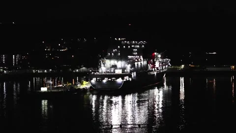 u.s. naval ship docked at night with lig... | Stock Video | Pond5