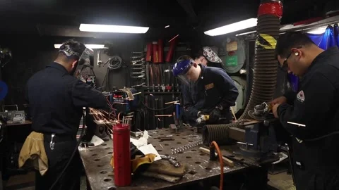 U.S. Navy fitters using angle grinders i... | Stock Video | Pond5