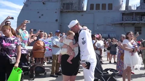 U.S. Navy sailor greets family on arrivi... | Stock Video | Pond5