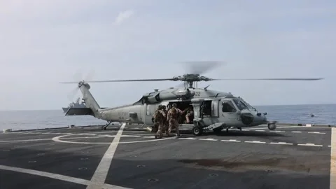 U.S. Navy sailors loading casualty on ta... | Stock Video | Pond5