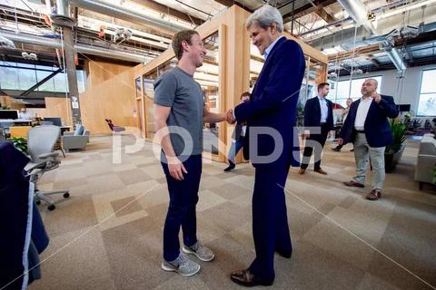 U.S. Secretary of State John Kerry uses his left hand to shake hands ...
