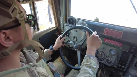 U.S. soldier driving light armoured vehi... | Stock Video | Pond5