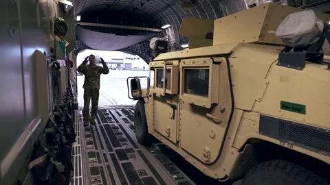 U.S. soldiers load military vehicles in ... | Stock Video | Pond5