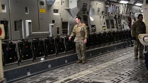 U.S. soldiers load military vehicles in ... | Stock Video | Pond5