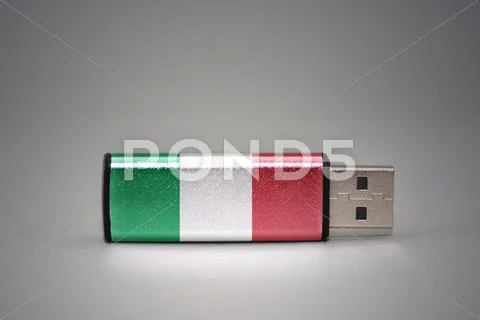 Usb flash drive with the national flag of italy on gray background ...
