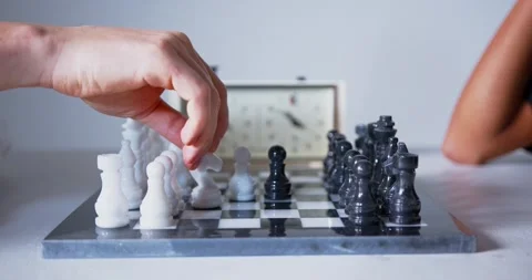 Using a chess clock during a blitz chess... | Stock Video | Pond5