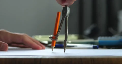 Using compass with pencil to draw a draw... | Stock Video | Pond5