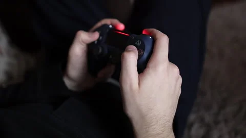 Using a controller playing video games -... | Stock Video | Pond5