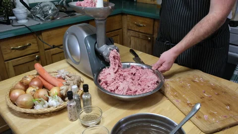 Using electric meat grinder to make fres... | Stock Video | Pond5