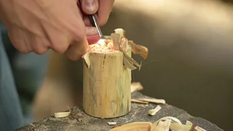Using flint and steel to light a campfir... | Stock Video | Pond5