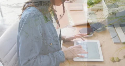 Using tablet at desk, woman with nature ... | Stock Video | Pond5