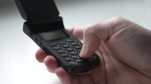 Using a Vintage Flip Phone from the 90s ... | Stock Video | Pond5