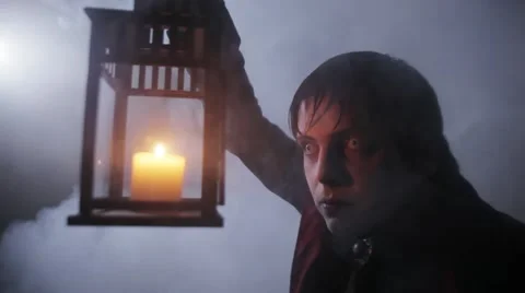 A vampire with a lamp in the mist dresse... | Stock Video | Pond5
